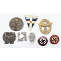 A collection of 8 Nazi German Pin Badges. A variety of designs, shapes ...