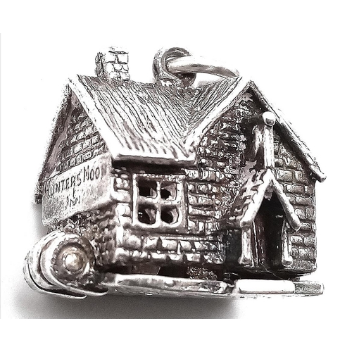 A Sterling Silver House Charm Which Opens. 1.8cm length, 5.7g total ...