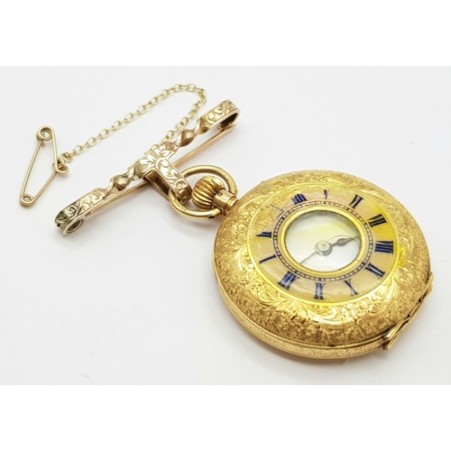 A Vintage 18K Gold Miniature Pocket Watch. A beautifully engraved half ...