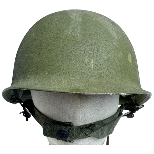 A Vietnam War era US M1 Army Military Pot Helmet.