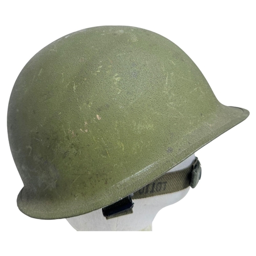 A Vietnam War era US M1 Army Military Pot Helmet.