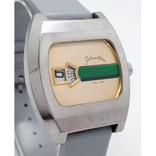 A Vintage Fashiontime Jump Watch. Grey rubber strap. Stainless steel ...