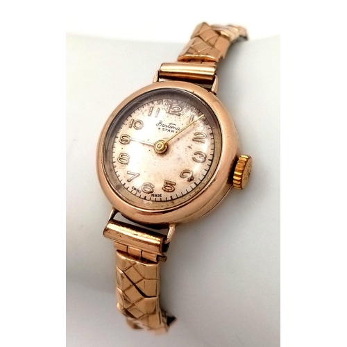 A 9K Yellow Gold Bentima Star Ladies Watch. Expandable gilded bracelet ...