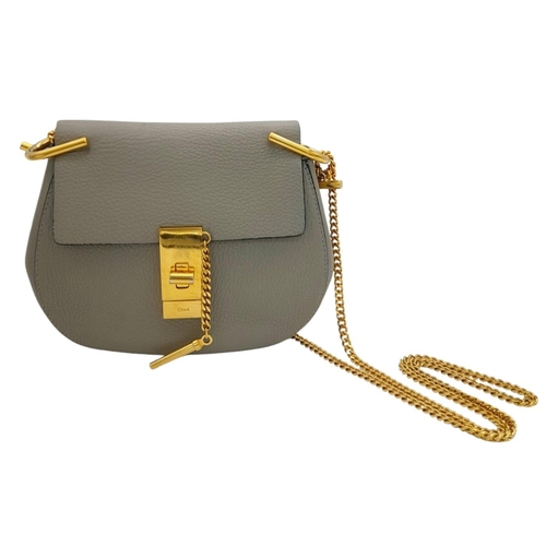 A Chloé Drew Shoulder Bag. Grained grey leather exterior with gold ...