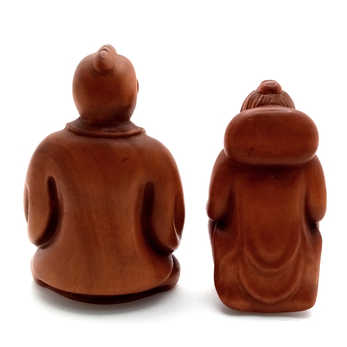 A pair of Japanese hand carved netsukes depicting a couple that can ...