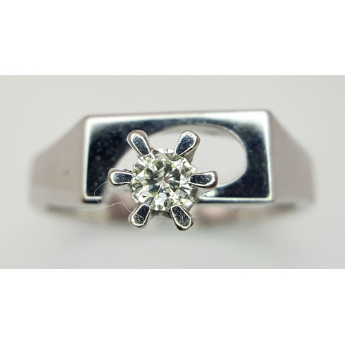 An 18K White Gold Diamond Solitaire Ring. 0.15ct round brilliant cut ...
