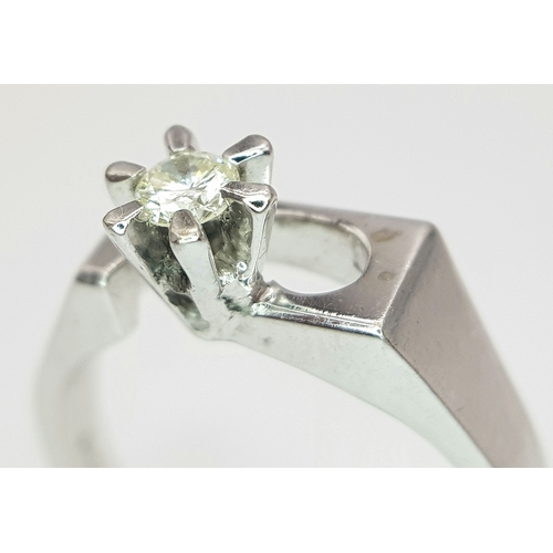 An 18K White Gold Diamond Solitaire Ring. 0.15ct round brilliant cut ...