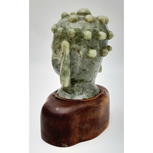 A Mid 18th Century Chinese Jade Buddha Head. Spinach colour. Comes with ...