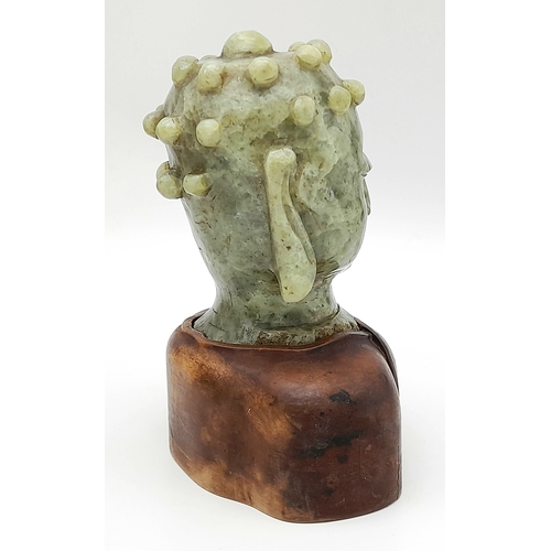 A Mid 18th Century Chinese Jade Buddha Head. Spinach colour. Comes with ...