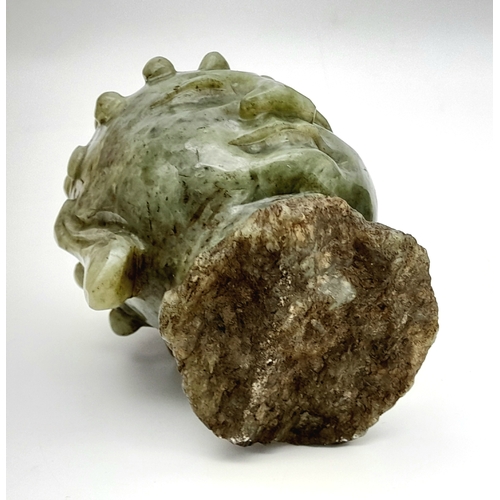 A Mid 18th Century Chinese Jade Buddha Head. Spinach colour. Comes with ...