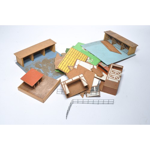 A group of vintage wooden farm related buildings, one marked Longacre Farm.