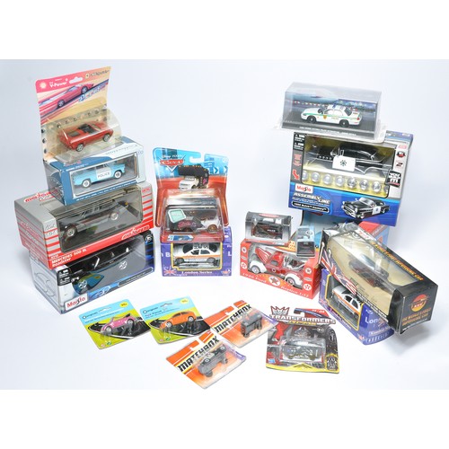 A mixed group of mostly boxed diecast model vehicles from various ...