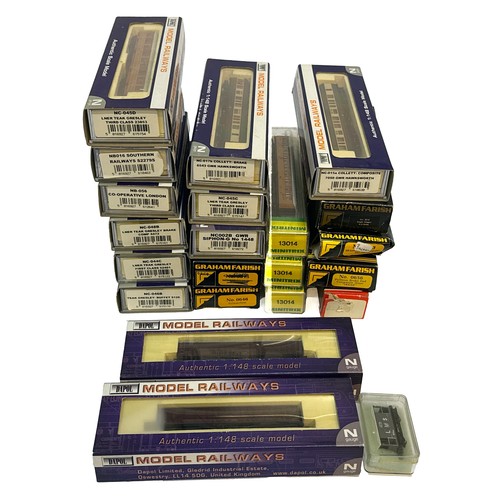A group of boxed N gauge model railway items including coaches and ...