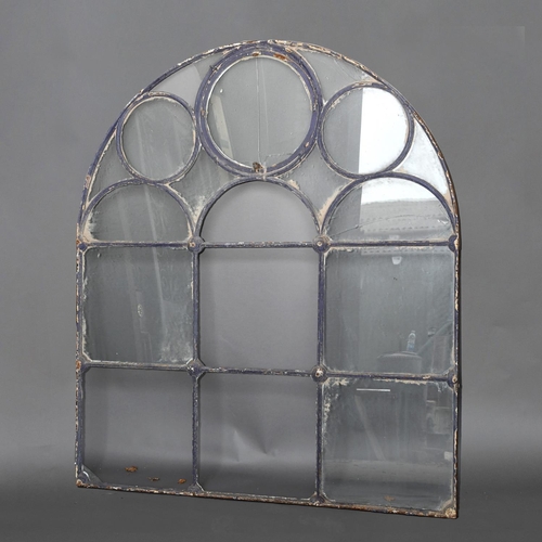 A CAST IRON 19TH CENTURY ROSETTE WINDOW FRAME. with bullseye opening ...