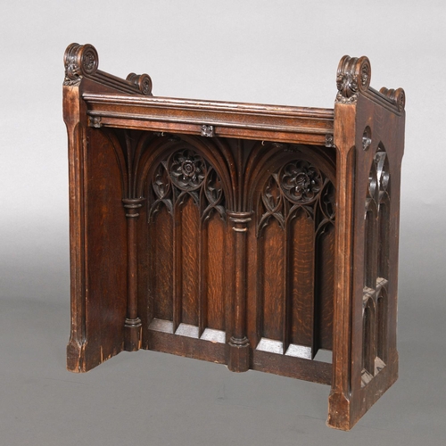 A GOTHIC OAK CHURCH LECTERN. with carved inner section and ends, height ...