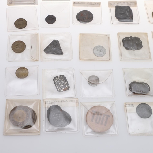 A MIXED COLLECTION OF ASSORTED BRASS TICKETS AND TOKENS. A collection ...