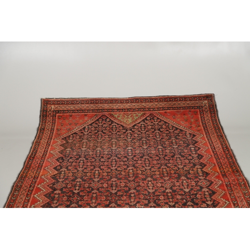 A MALAYIR RUG, WEST IRAN, CIRCA 1920. the deep indigo serrated Herati ...