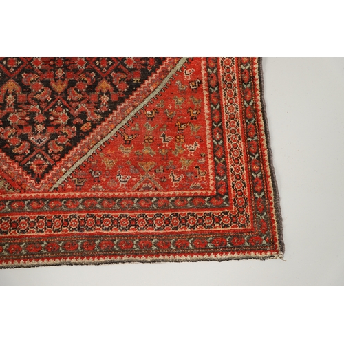 A MALAYIR RUG, WEST IRAN, CIRCA 1920. the deep indigo serrated Herati ...