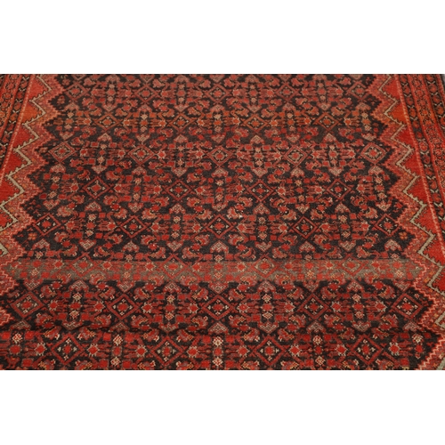 A MALAYIR RUG, WEST IRAN, CIRCA 1920. the deep indigo serrated Herati ...