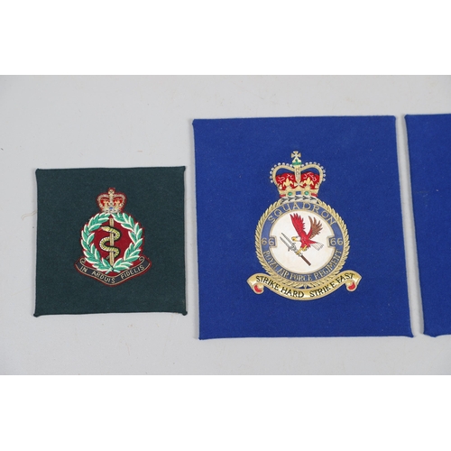 A COLLECTION OF FRAMED NEEDLEWORK MILITARY AND ROYAL CRESTS. A framed ...