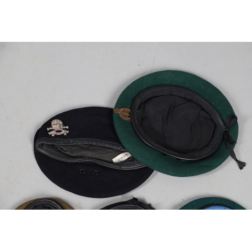 A COLLECTION OF MILITARY UNIFORM BERETS. A collection of Military ...