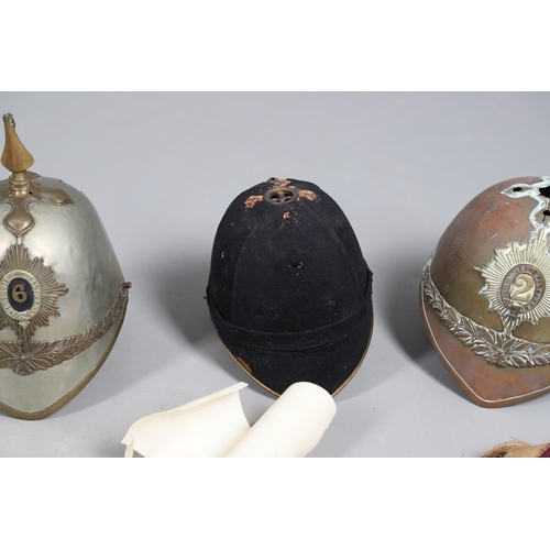 A COLLECTION OF VICTORIAN AND LATER HELMETS AND PARTS TO INCLUDE 1871 ...