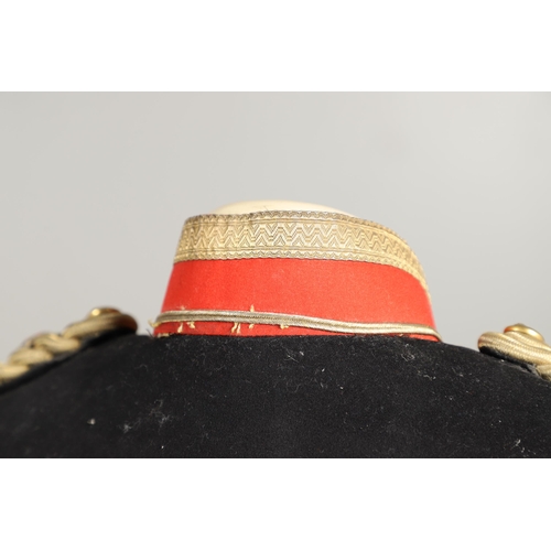 A VICTORIAN ROYAL ARTILLERY MESS JACKET. A black mess jacket with red ...