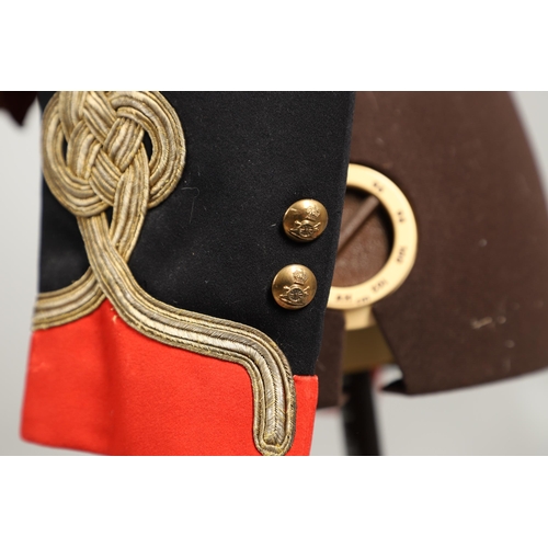 A VICTORIAN ROYAL ARTILLERY MESS JACKET. A black mess jacket with red ...