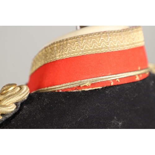A VICTORIAN ROYAL ARTILLERY MESS JACKET. A black mess jacket with red ...