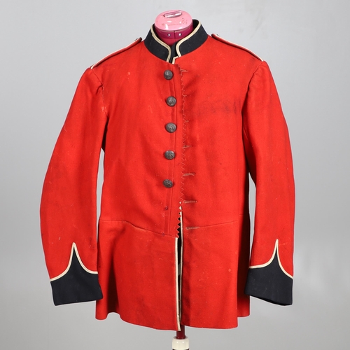 AN EARLY 20TH CENTURY SCARLET TUNIC WITH GENERAL SERVICE BUTTONS. An ...