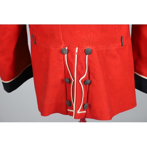 AN EARLY 20TH CENTURY SCARLET TUNIC WITH GENERAL SERVICE BUTTONS. An ...
