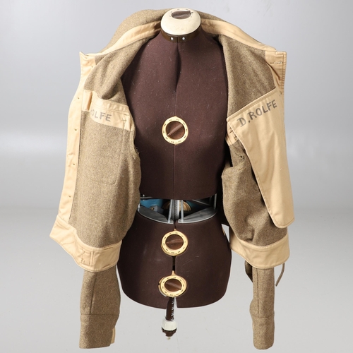 A COLLECTION OF SECOND WORLD STYLE BATTLE TUNICS AND TROUSERS. A ...