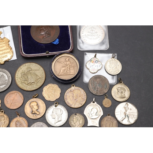 A COLLECTION OF COMMEMORATIVE AND SPORTING MEDALS. A collection of ...