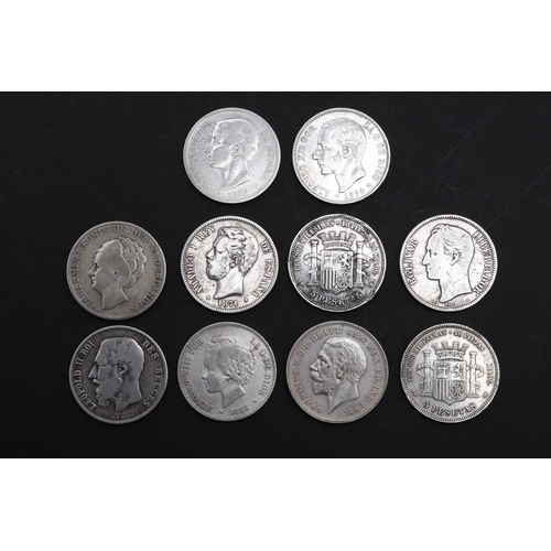 A COLLECTION OF TEN CROWN SIZED SILVER WORLD COINS TO INCLUDE SPAIN AND ...