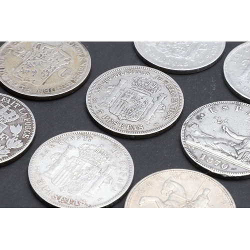 A COLLECTION OF TEN CROWN SIZED SILVER WORLD COINS TO INCLUDE SPAIN AND ...