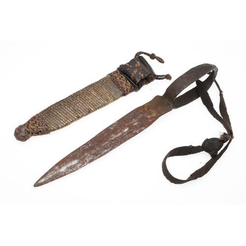 A NORTH AFRICAN DAGGER WITH OPEN HANDLE AND SNAKE-SKIN SHEATH. With a ...