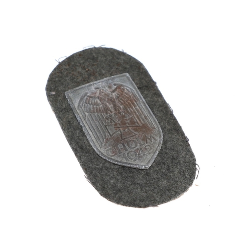 A SECOND WORLD WAR GERMAN CHOLM SHIELD. A Cholm 1942 shield with dark ...