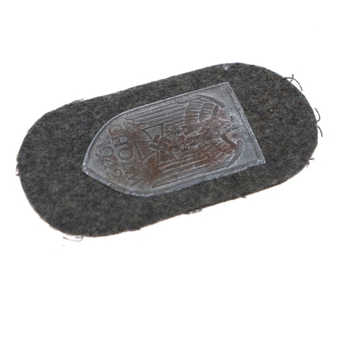 A SECOND WORLD WAR GERMAN CHOLM SHIELD. A Cholm 1942 shield with dark ...
