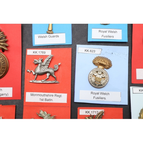 A COLLECTION OF EIGHTEEN BADGES FOR WELSH REGIMENTS. A collection of ...