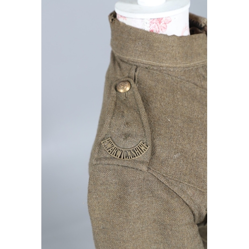 A FIRST WORLD WAR OTHER RANKS SERVICE DRESS TUNIC, 1902 PATTERN. A 1902 ...