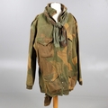 A REPRODUCTION DENISON SMOCK. A Dennison type smock with label for K&C ...