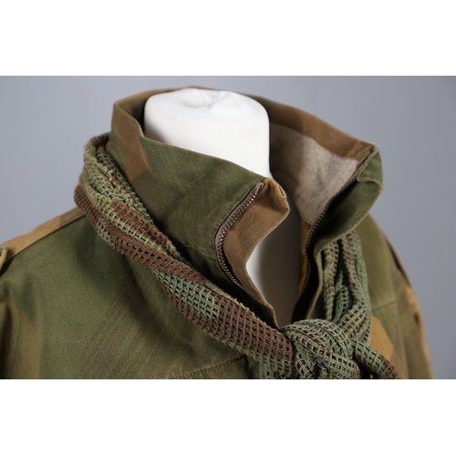 A REPRODUCTION DENISON SMOCK. A Dennison type smock with label for K&C ...