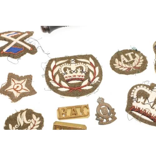 TWO FAIRBAIRN SYKES TYPE KNIVES AND A COLLECTION OF UNIFORM PATCHES. A ...