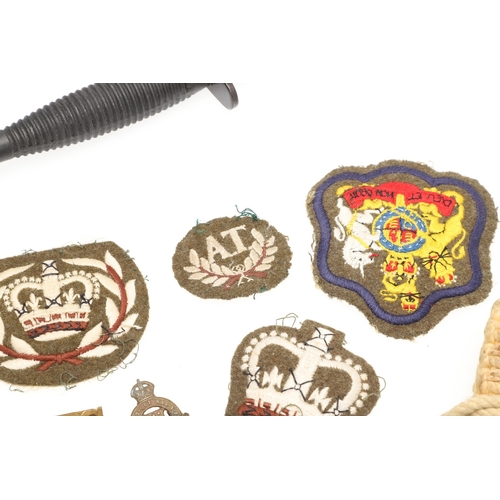 TWO FAIRBAIRN SYKES TYPE KNIVES AND A COLLECTION OF UNIFORM PATCHES. A ...