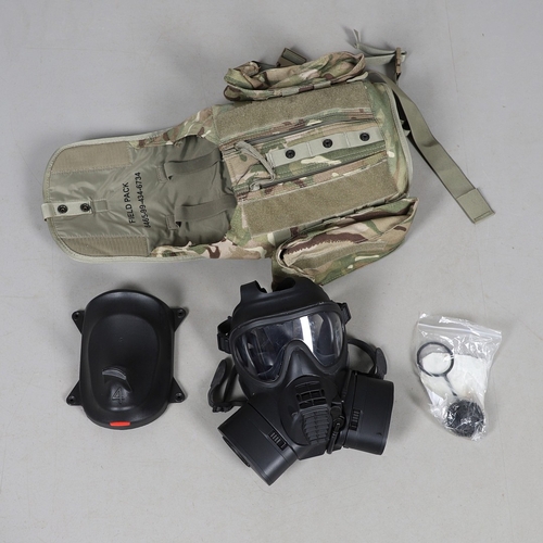 A BRITISH ARMY GSR RESPIRATOR AND PACK. A GSR respirator, Size 4, in ...