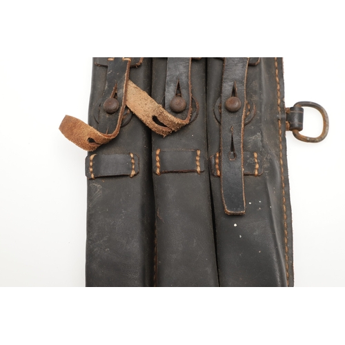 A GERMAN SUBMACHINE GUN MAGAZINE POUCH. A magazine pouch for three ...