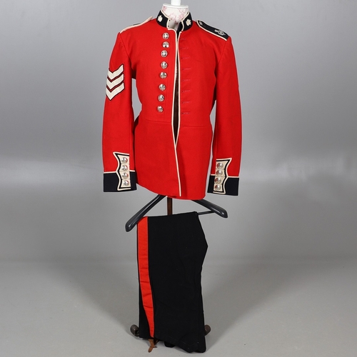 A GRENADIER GUARDS TUNIC AND TROUSERS. A Grenadier Guard's tunic with ...