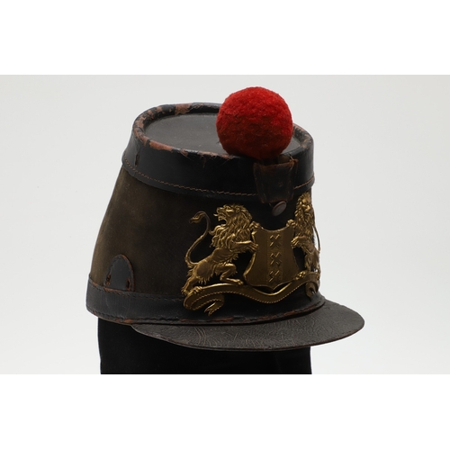 A LATE 19TH CENTURY DUTCH POLICE SHAKO. A police shako with brass plate ...