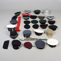 A VARIED COLLECTION OF MILITARY UNIFORM CAPS. A collection of 26 ...