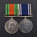 A SECOND WORLD WAR POLICE PAIR TO CONSTABLE BARKER. A pair comprising ...